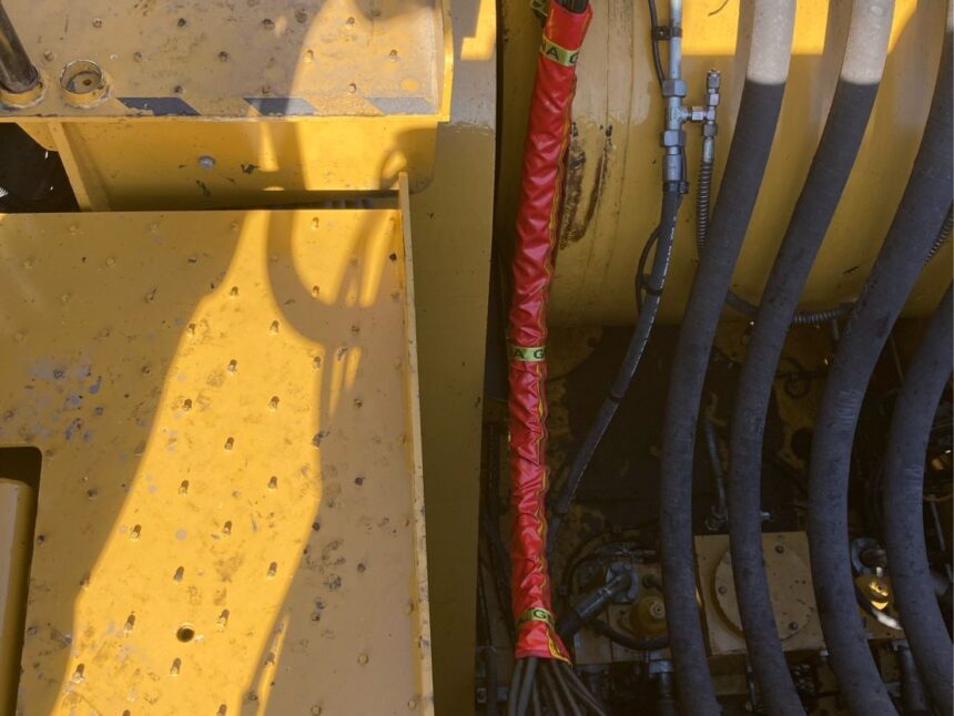 Customised Hydraulic Hose Burst Sleeving protecting Maintainers